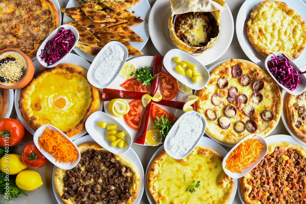Table scene of assorted take out or delivery foods. Traditional Turkish ...