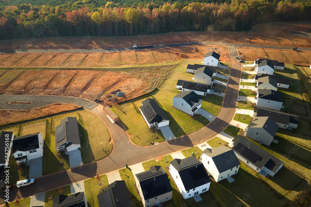 Aerial view of real estate development with tightly located family ...