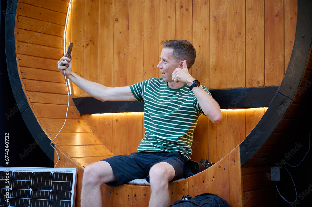 Excited photographer looks at the photos he just took. Young ...
