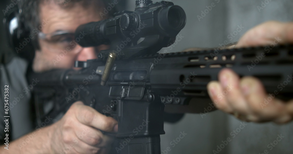 Firing an Assault rifle in super slow-motion 800 fps. Person shooting ...