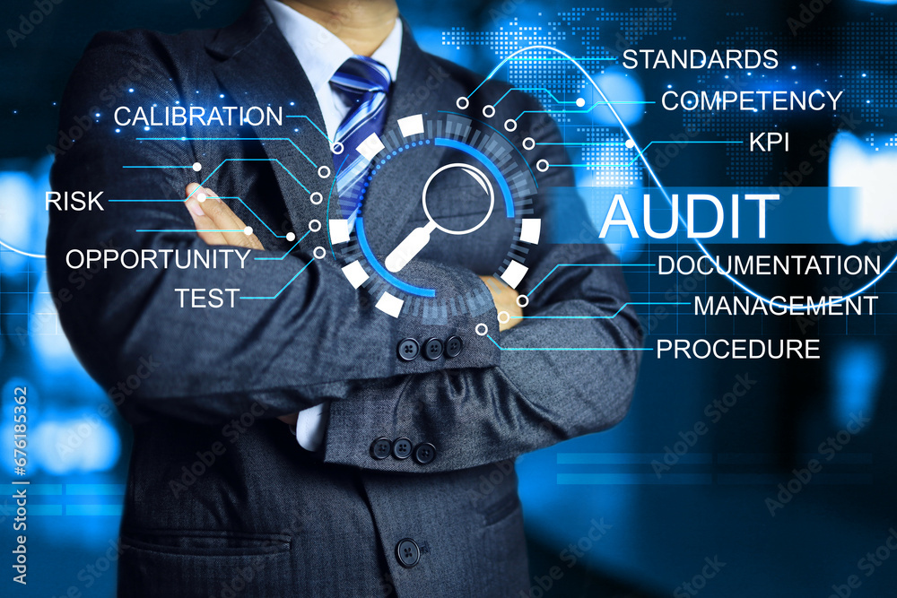 Auditor standing with cross arm to audit factory annual assessment ...