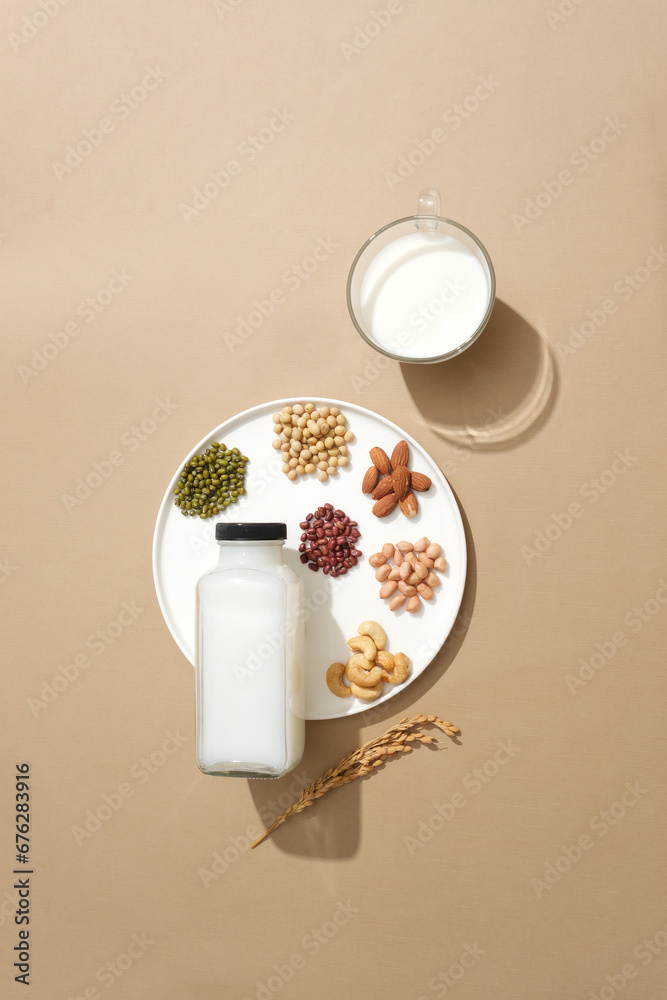 Glass bottle and cup filled with milk and a ceramic dish featured ...