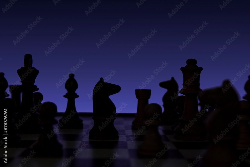 Knight in a chess duel on the chessboard. Low-key concept picture of ...