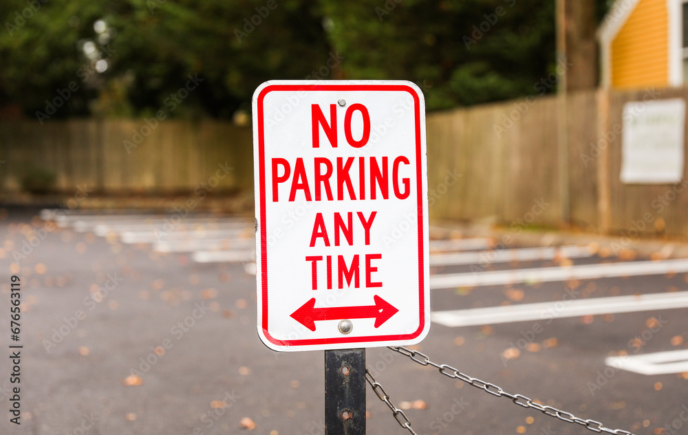 No Parking sign against an urban backdrop, a symbol of restricted ...