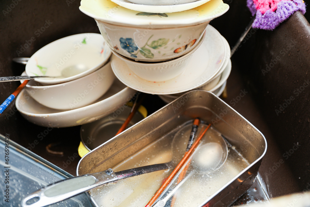 hand-washing dishes, symbolizing equality and shared responsibilities ...