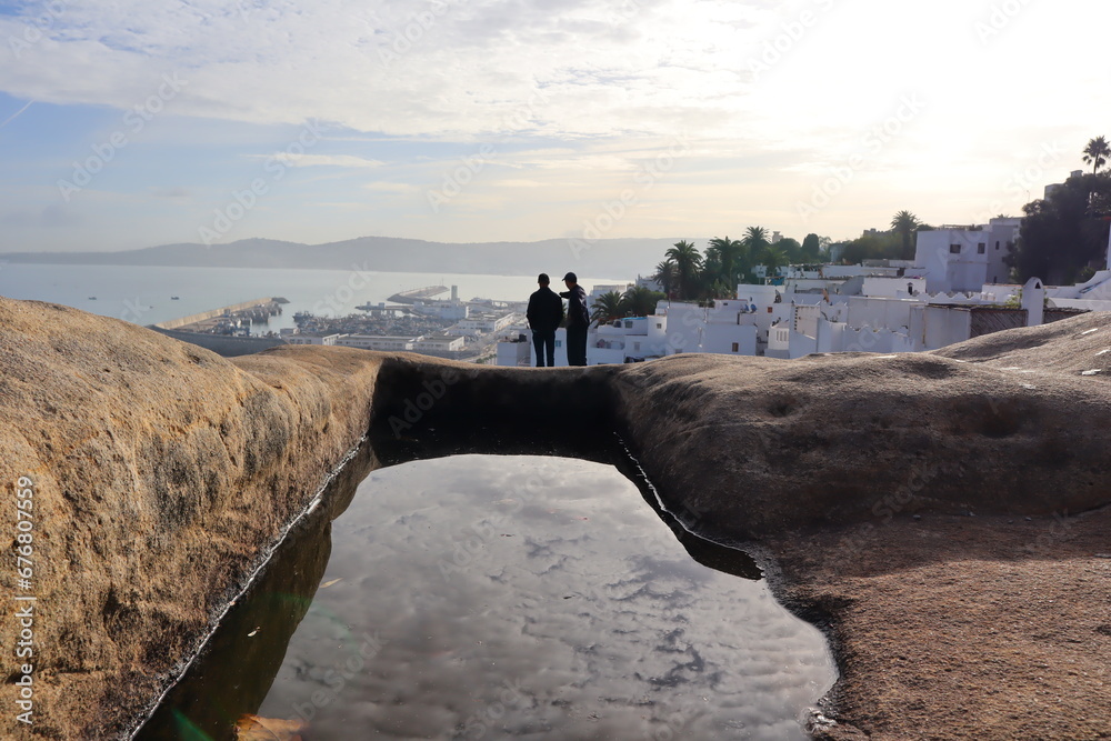 A panoramic view of the old city of Tangier with a view of the sea and ...