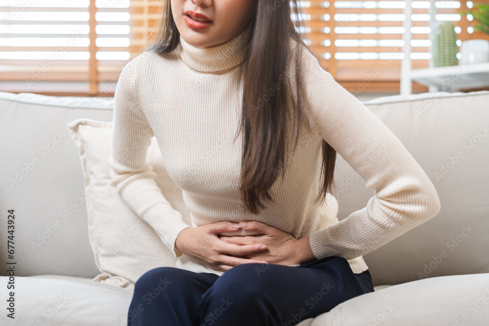 Flatulence asian young woman, girl hand in stomach ache, suffer from ...