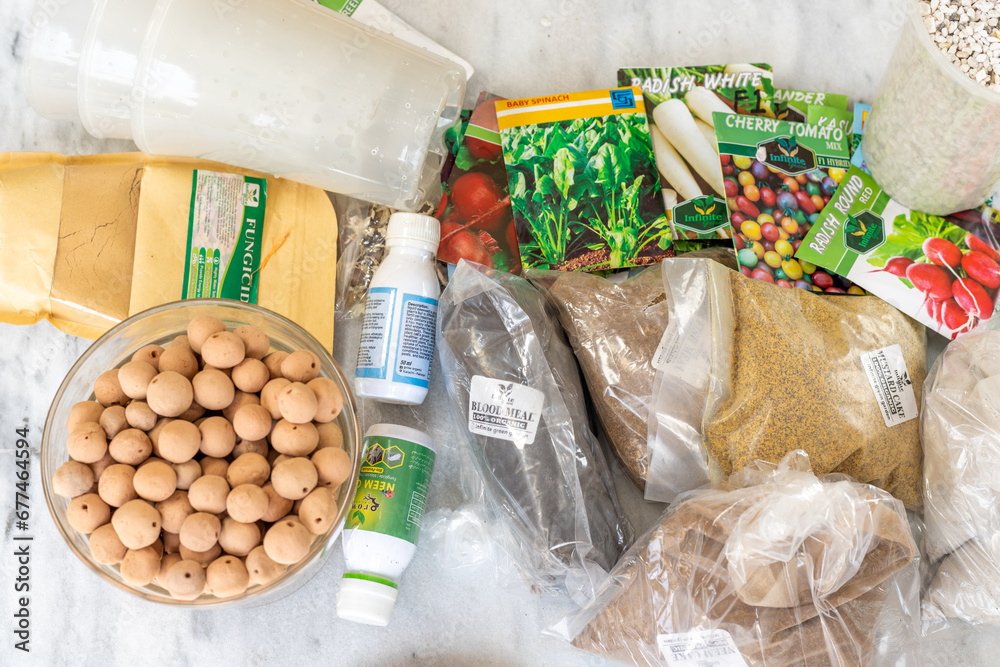 Various packets of vegetable seeds and organic fertilizer plant food ...