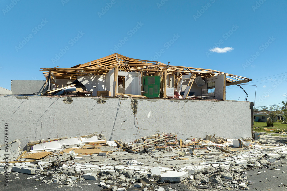 Wind destroyed house roof and walls with missing asphalt shingles after ...