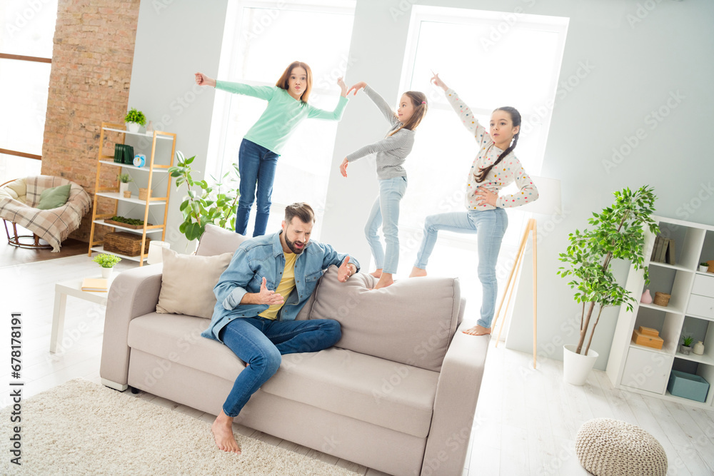 Full size photo of four people unsatisfied guy sit on couch hands ...