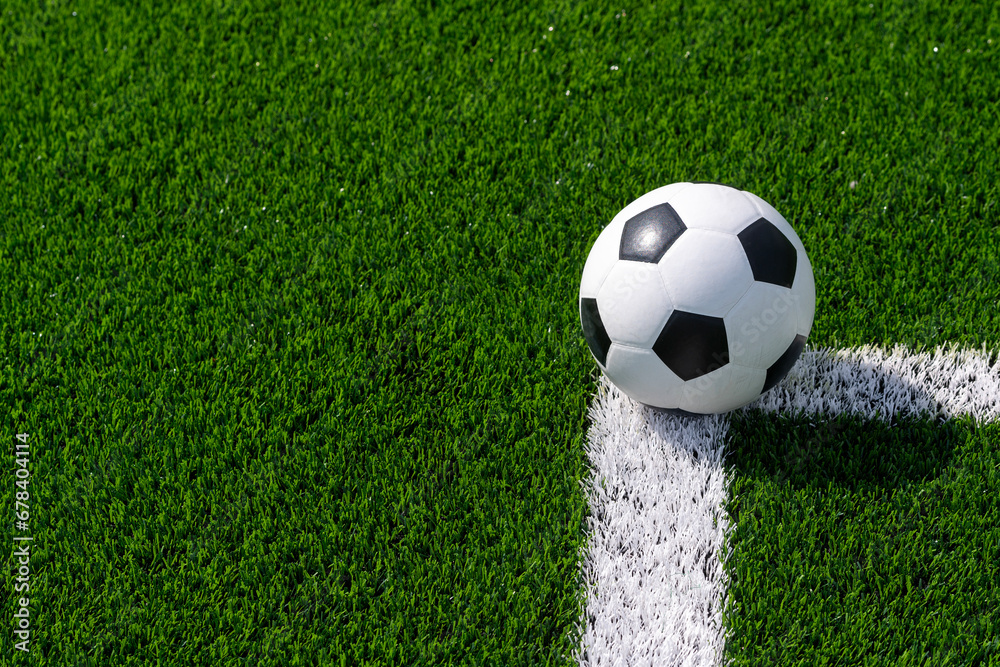Black and white soccer and football ball in the field. Horizontal sport ...
