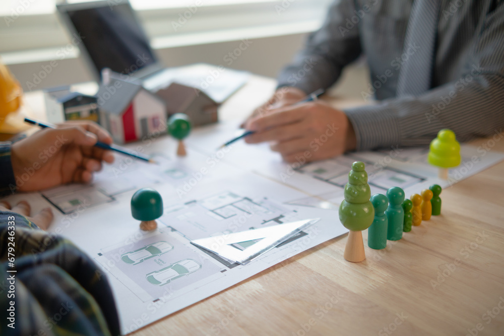 Construction engineers discuss and exchange ideas with architects to ...