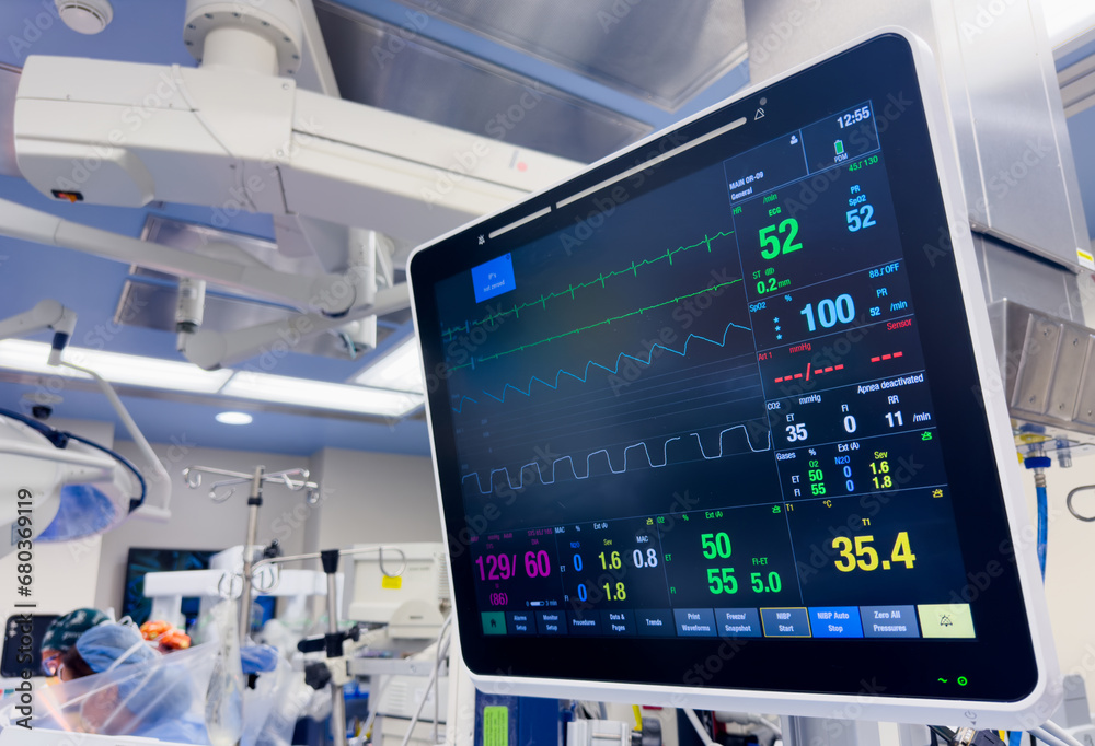 Hospital monitor displaying vital signs: heart rate, blood pressure ...