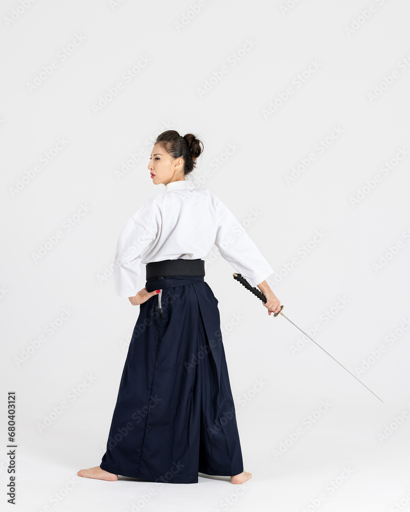Aikido master woman in traditional samurai hakama kimono with black ...