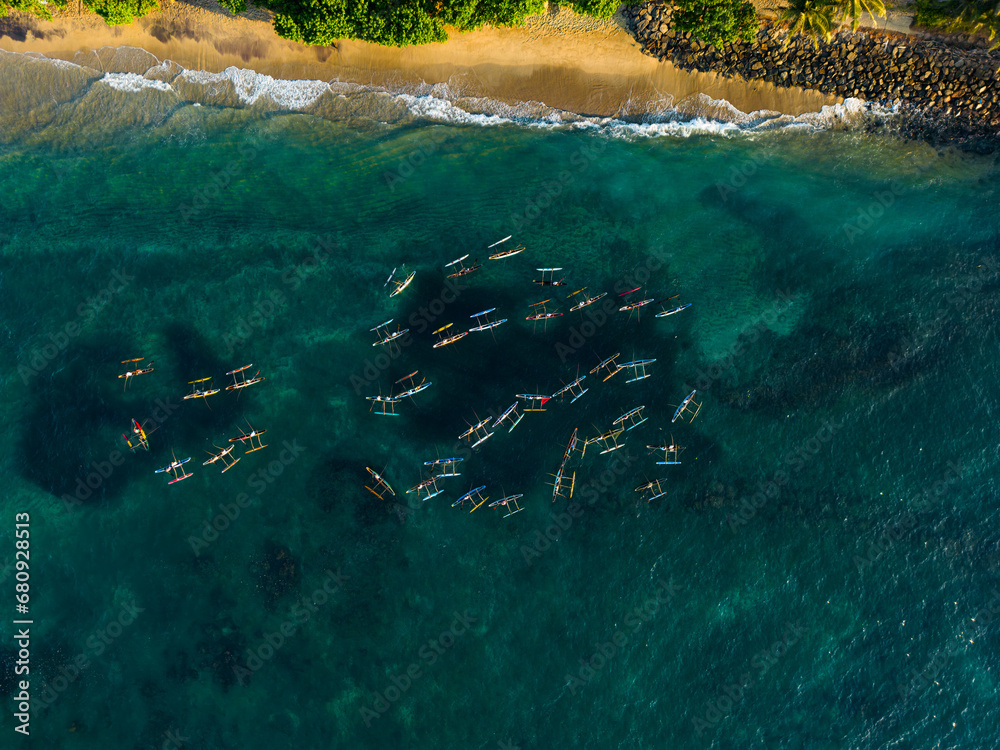 Aerial view of traditional oruwa boats as local fishermen navigate the ...