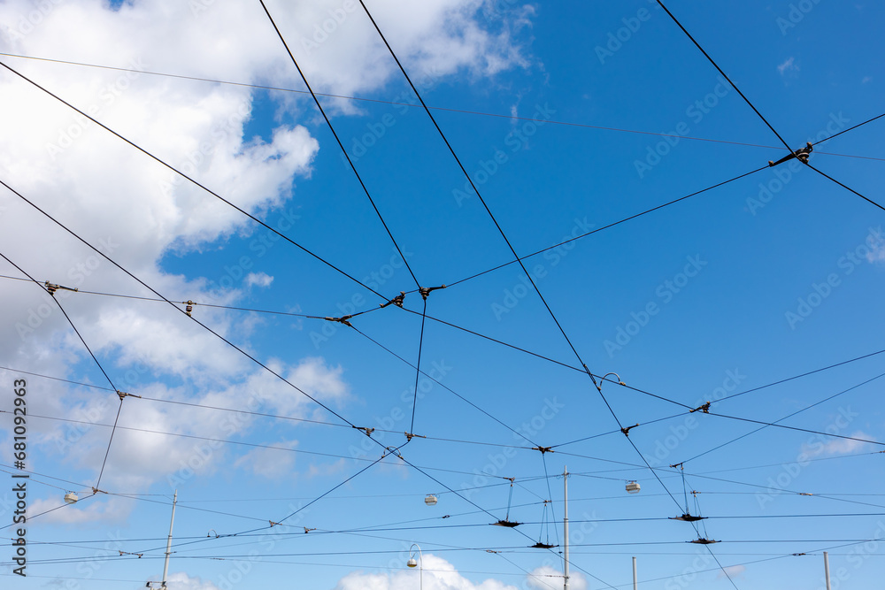 Selective focus of busy cable lines under blue sky, The connecting of ...