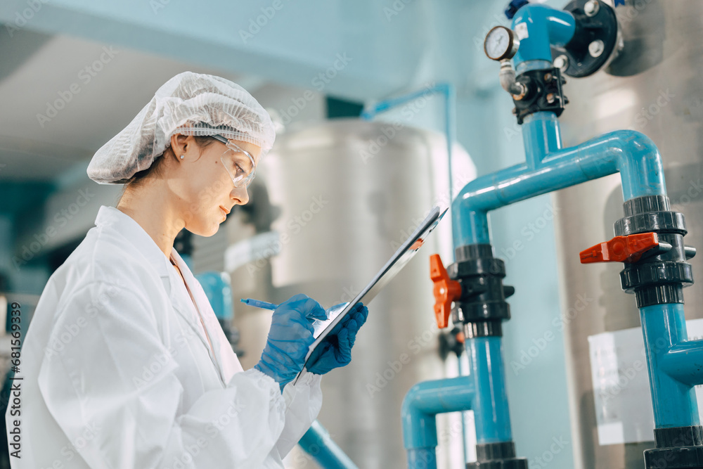 Drinking water factory purification process. Hygiene factory worker ...