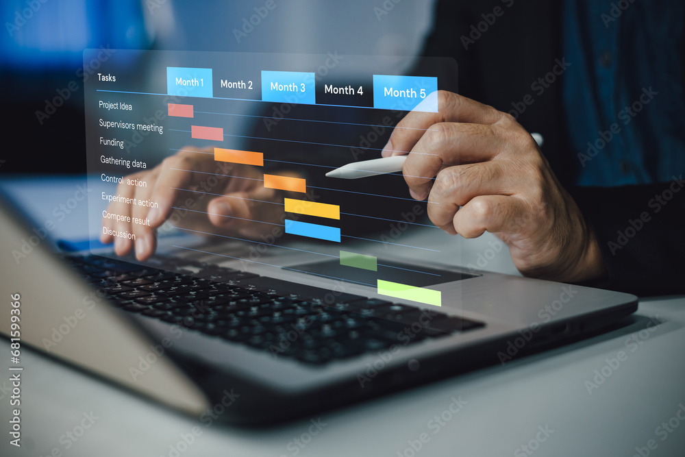 Project manager working and update tasks with milestones progress ...