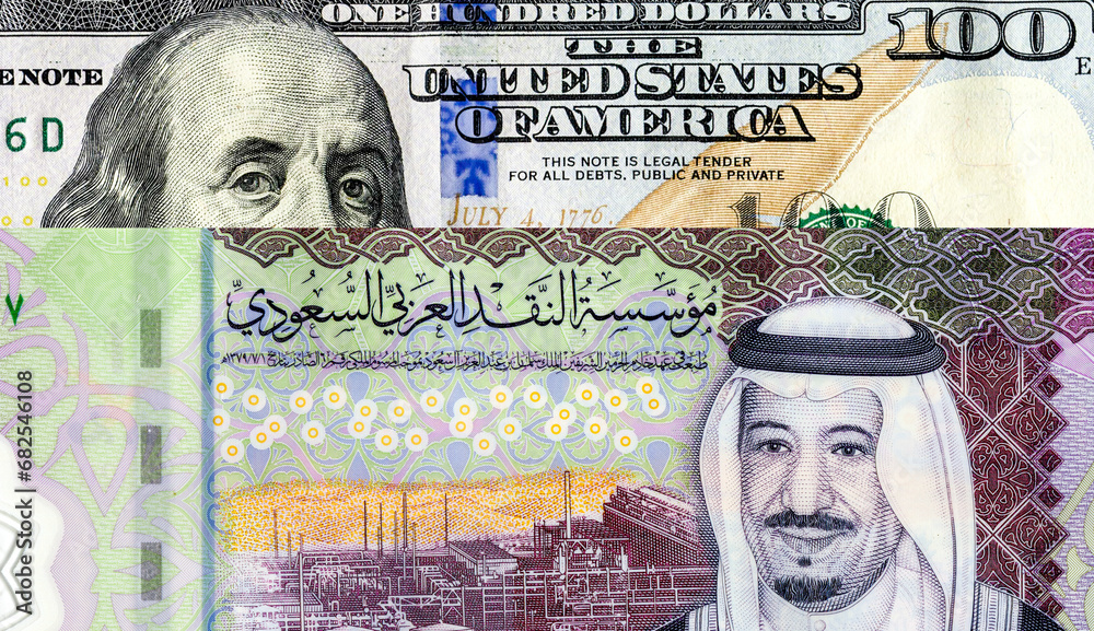 Saudi Arabia banknote with King Salman and American dollars banknote ...