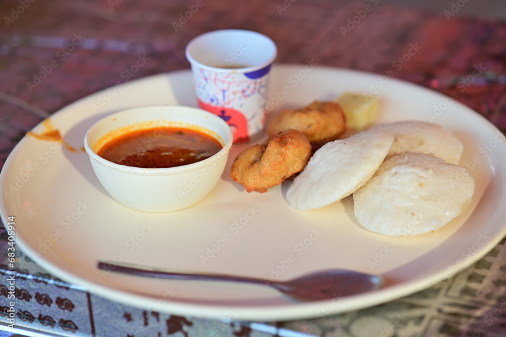 cup of coffee and south indian breakfast. idli and fried vada. Bowl ...