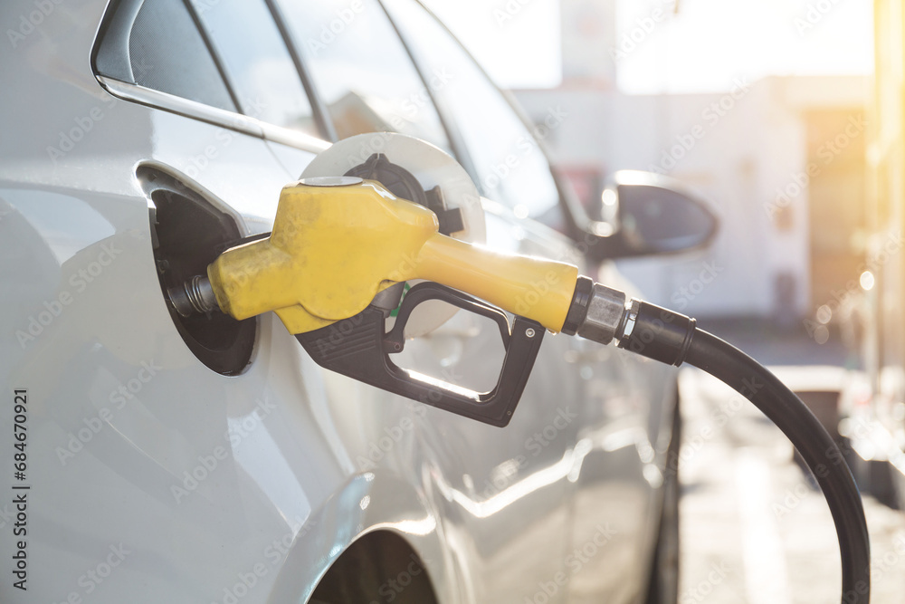 gas tank hatch. Refueling a passenger car with gasoline. refuel the car ...