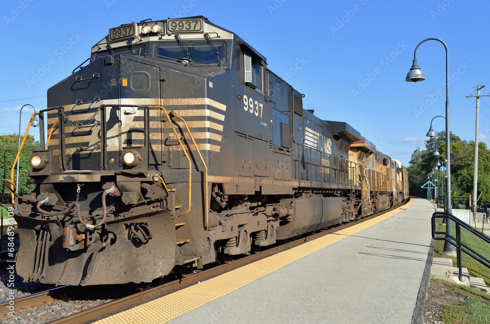A westbound Union Pacific Railroad freight train, led by an off-road ...