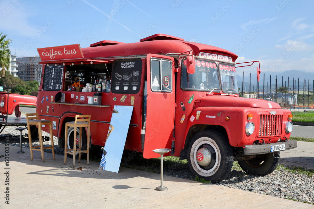 Batumi, Georgia - October 6, 2023: food truck, red old retro school bus ...