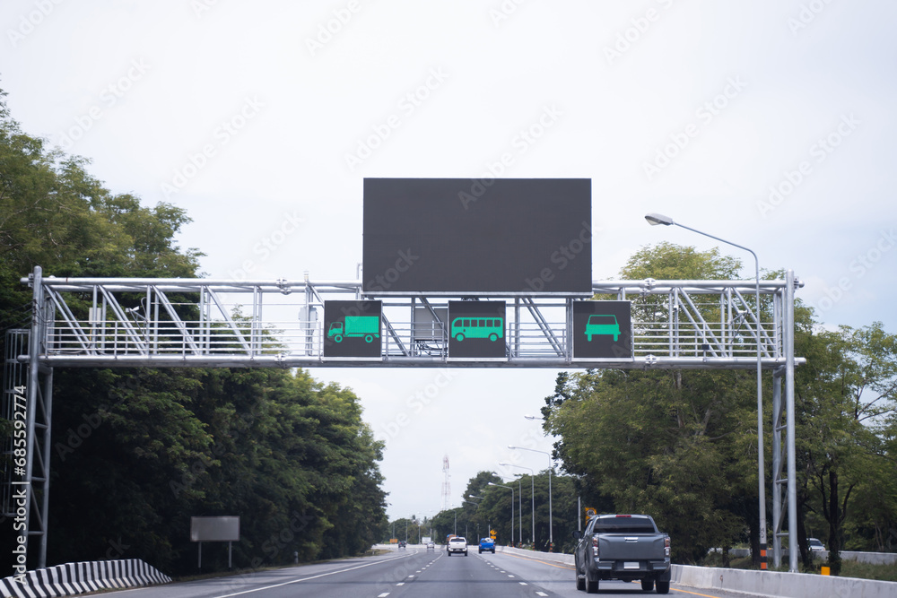 Road signs warn of "average speed detection zones" and speed limits for ...