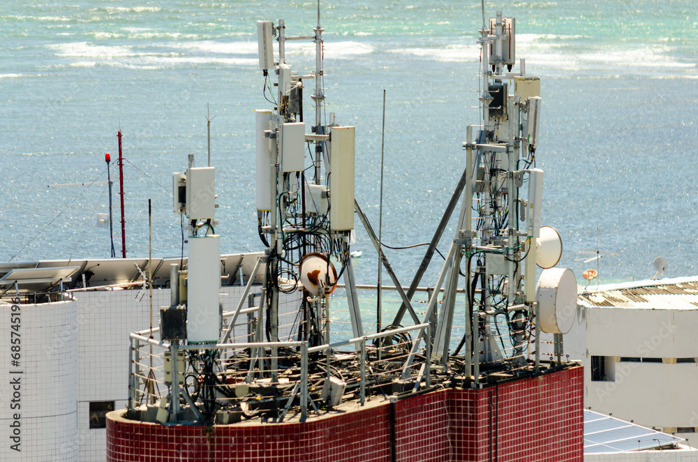 Mobile communication antennas on top of a Building. Round shaped ...