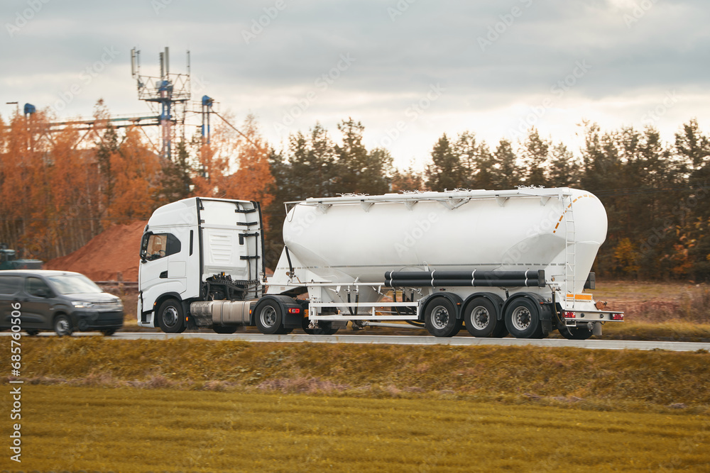 Semi truck with propane tank moving on asphalt road. ADR dangerous ...