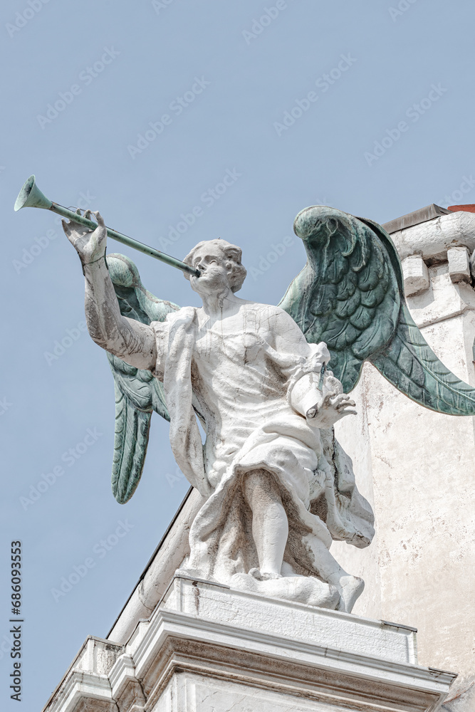Venice, Italy. Beautiful angel with wings and musical instrument pipe ...