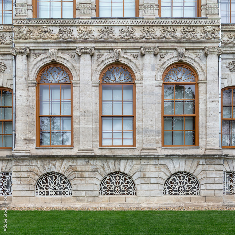 Side wall at Dolmabahce Palace, with three arched sash windows. Palace ...