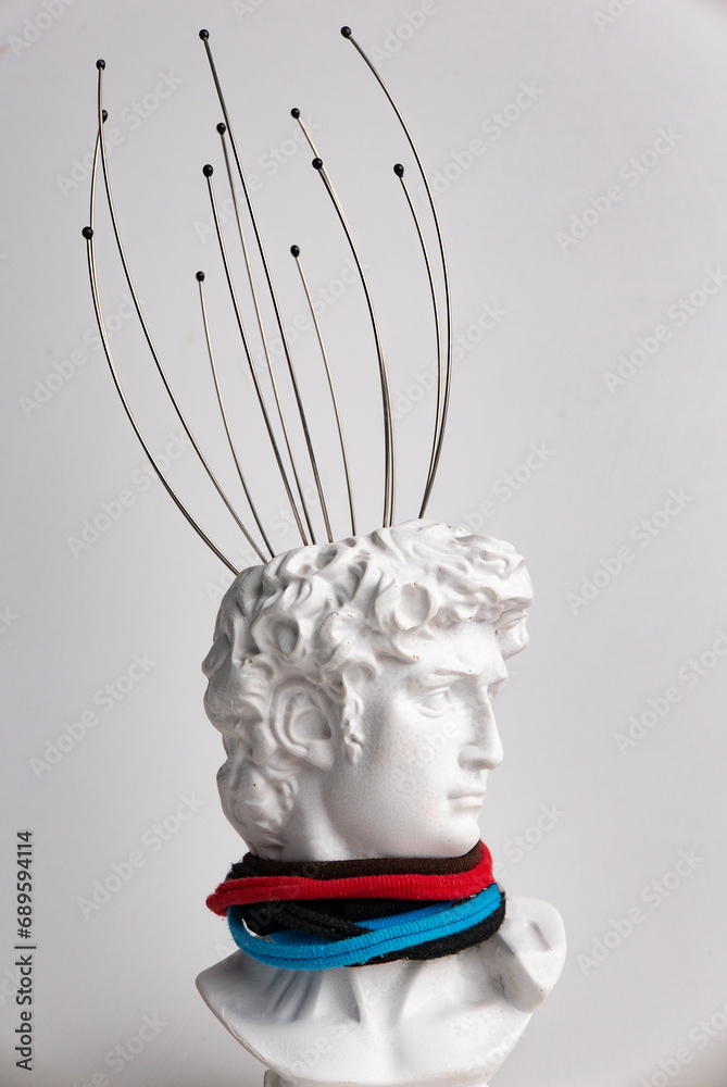 Antique male David statue's head with manual Massager for head isolated ...
