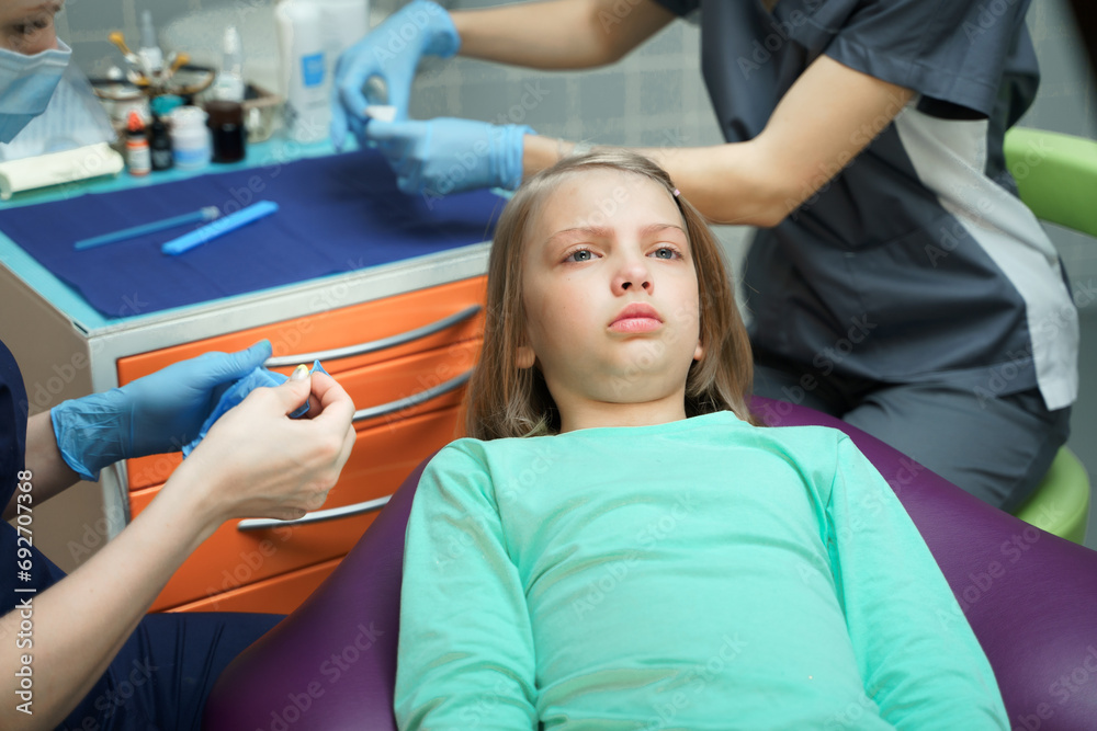 Little scared girl sitting in chair in dentist doctor office. Kid,child ...