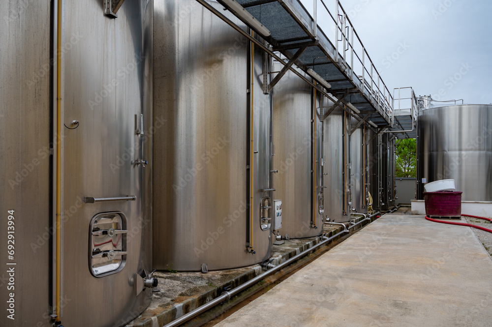 Works at distillery. Harvest time in Cognac white wine region, Charente ...