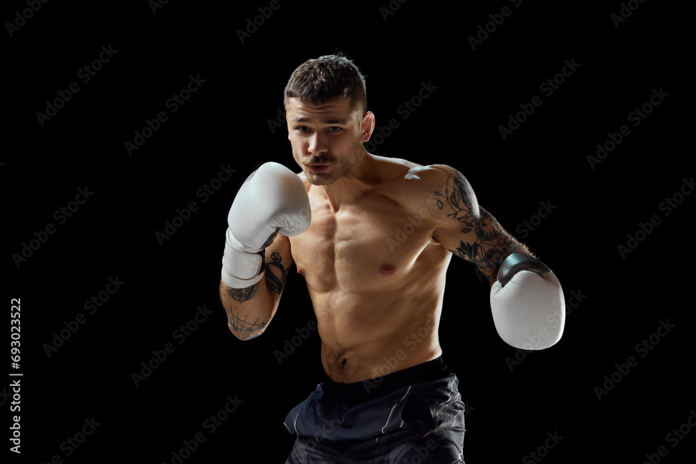 Stock-Foto „Concentrated serious young man, shirtless boxing athlete ...