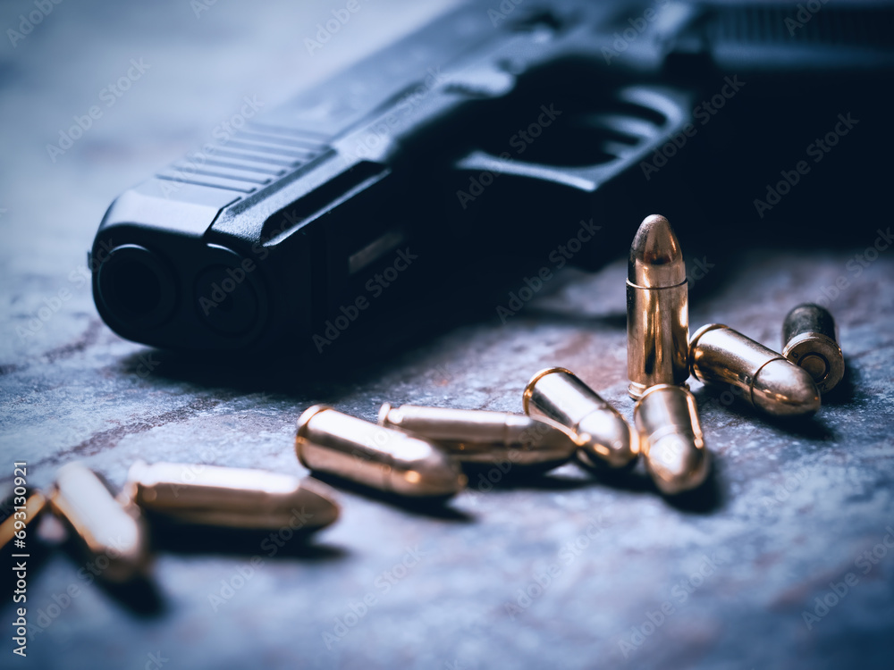 Hand gun with ammunition on dark background. 9 mm pistol military ...