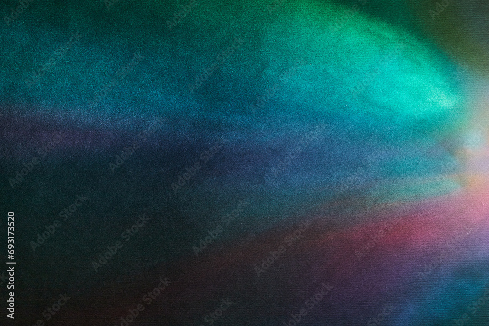 Soft Bright multicolored glare on dark rough textured cardboard. Soft ...