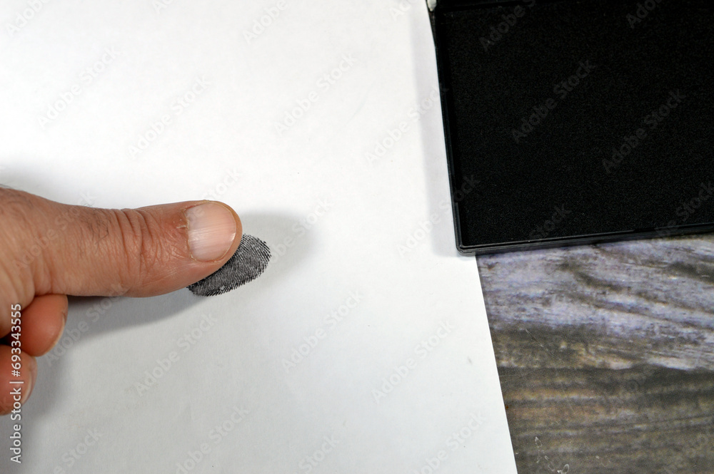 Stock-Foto „A fingerprint and a black color stamp ink pad, finger print ...