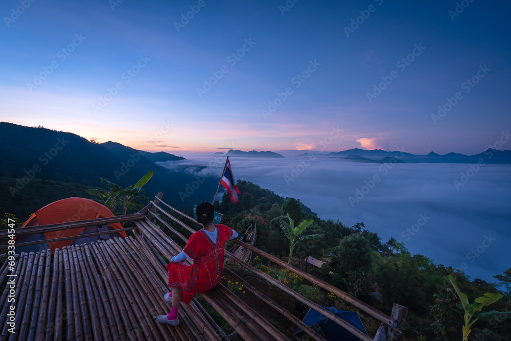 Asian traveler woman wearing a Red Karen Dress is happy with the ...