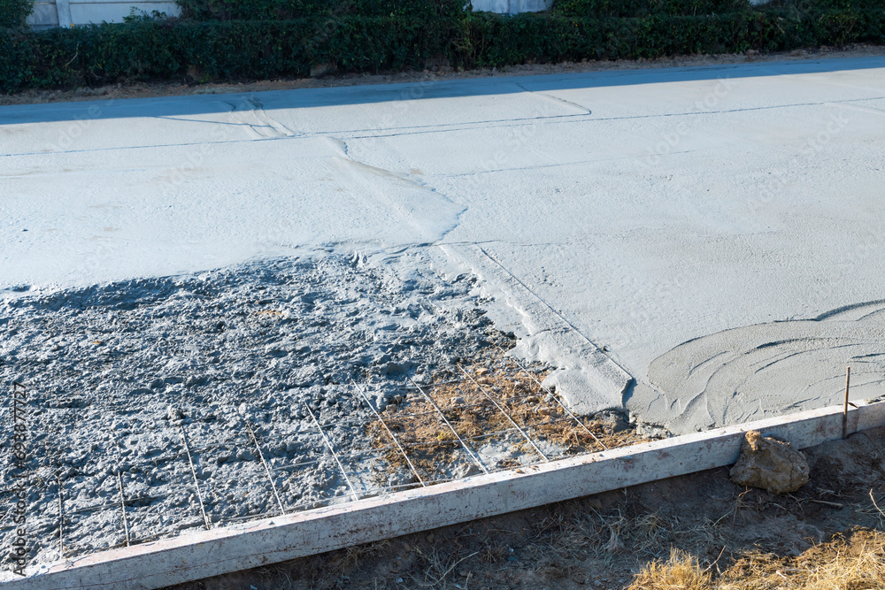 pouring concrete floor reinforced with rebar and square frame. Lay ...