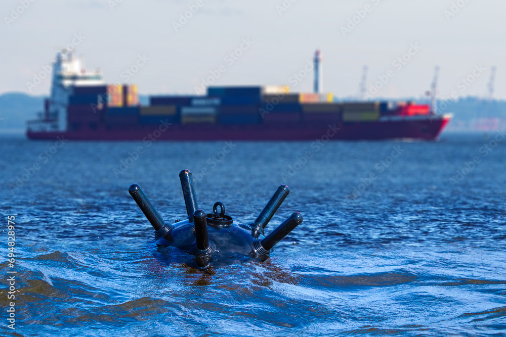 Stock-Foto „Underwater bomb near ship with containers. Ocean mine for ...