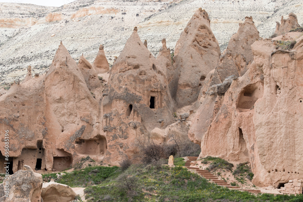 cave rooms, and churches carved into volcanic rock cliffs at Zelve Open ...