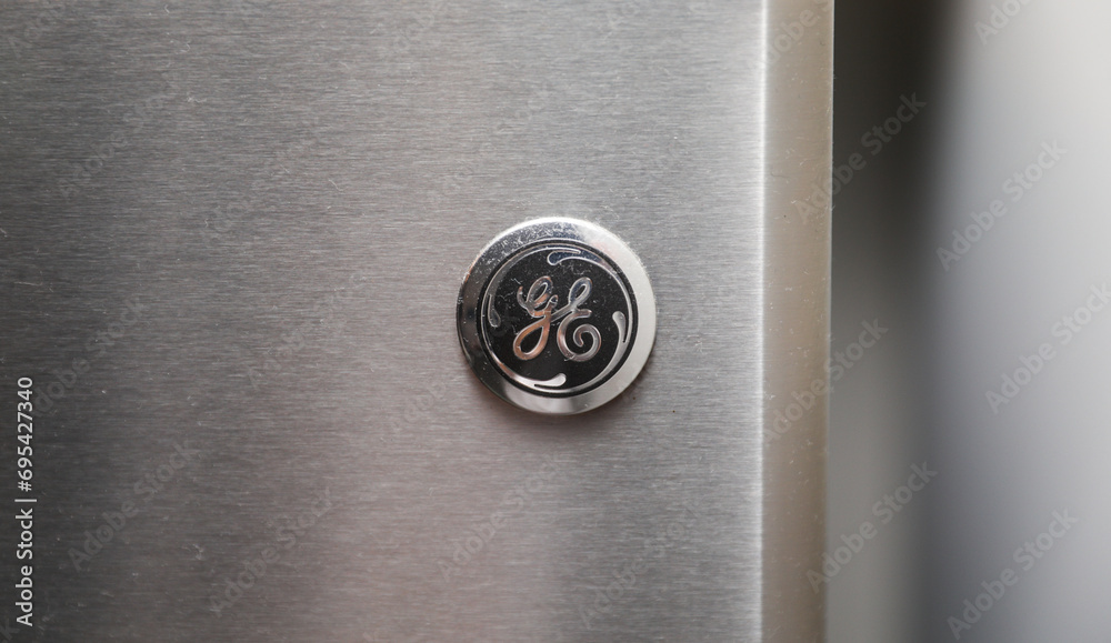 Chicago, IL, USA, December 19, 2023, GE sign logo against city skyline ...