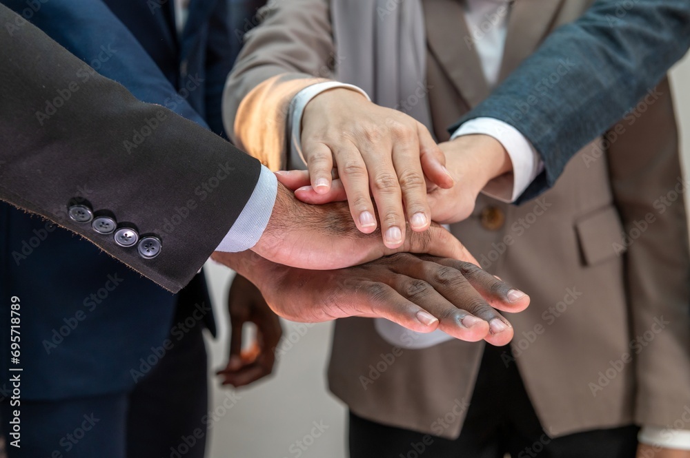 multiethnic business teamwork putting join hands together. Unity and ...