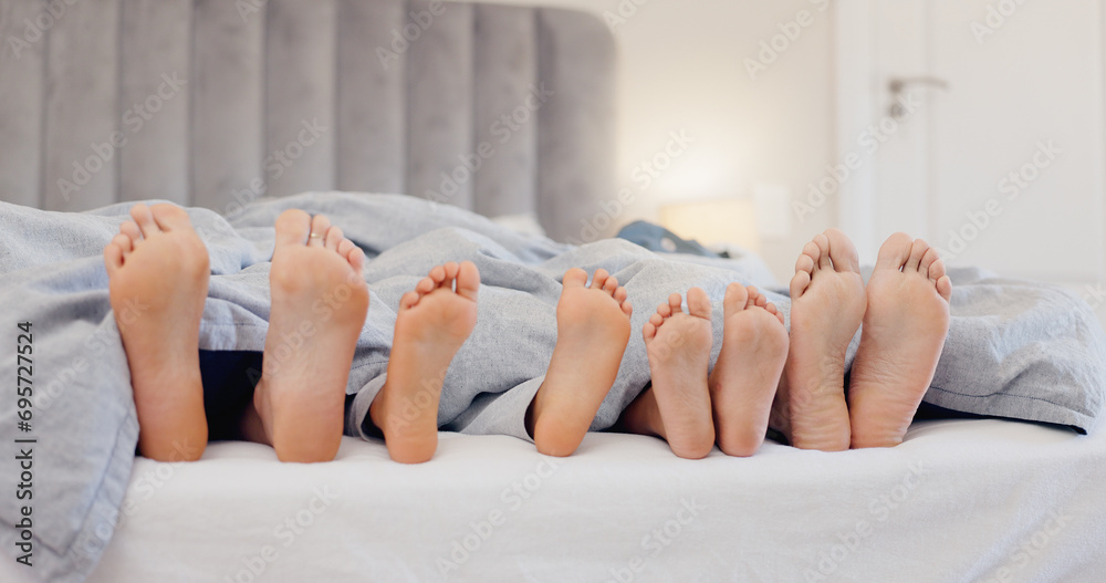 Sleeping feet, relax and family in bed with love, bond or security at ...