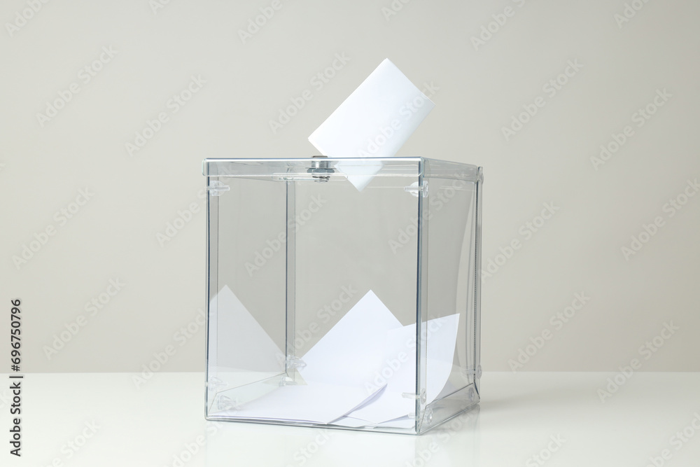 Transparent box and voting papers on gray background Stock Photo ...