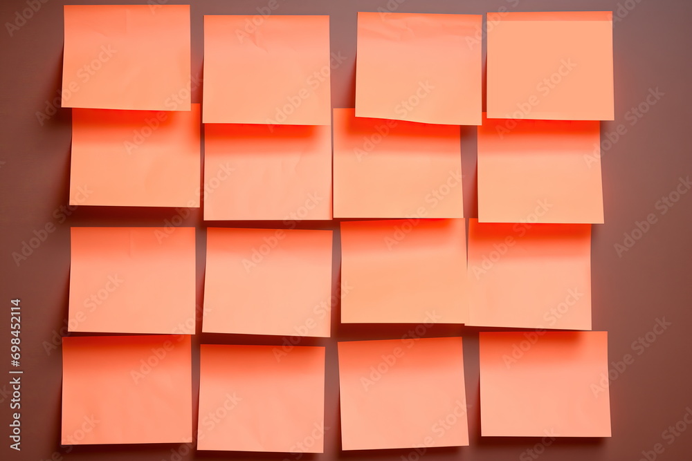 Four rows of sticky notes on the wall. Peachy pieces of paper for ...