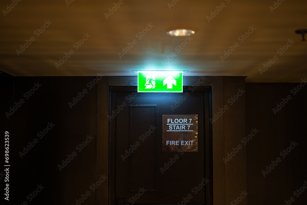 Fire exit neon lighting that installed on ceiling in front of fire ...