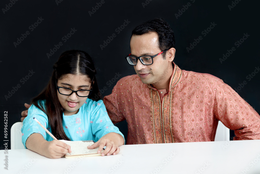 Cute Indian school student girl in India traditional dress do homework ...